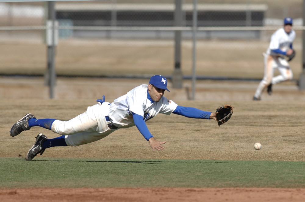 alazar dives for a hard hit ground ball - Classroom Clip Art