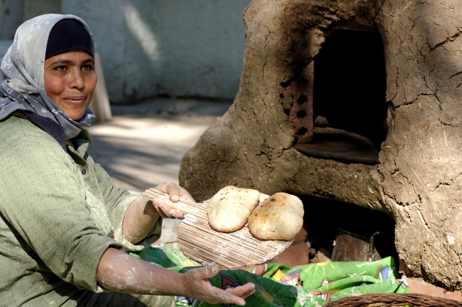 Egyptian women making fresh bread 5438 - Classroom Clip Art
