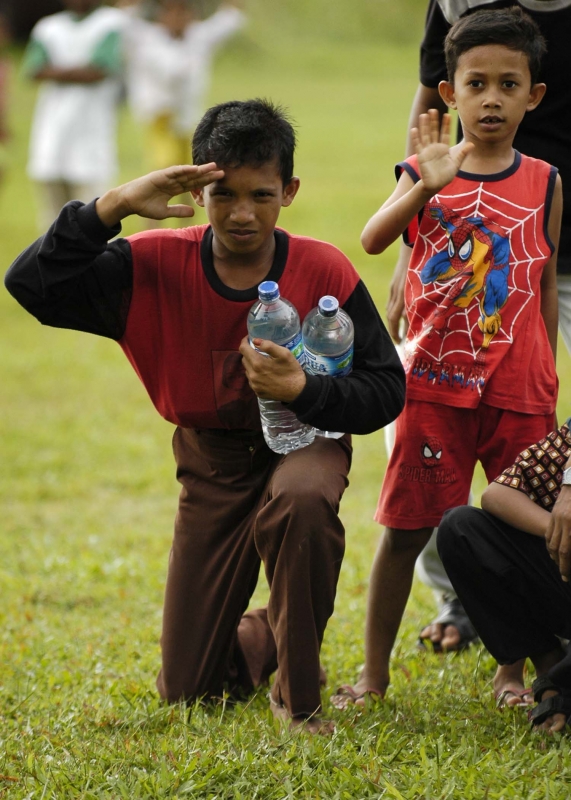 hand salute is rendered by an Indonesian child - Classroom Clipart