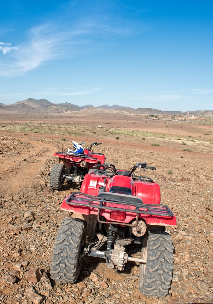red quad bikes in the moroccan stone desert 7616a - Classroom Clip Art