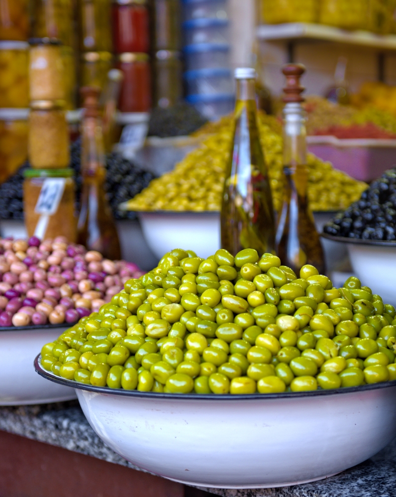variety of colorful olives for sale at traditional Moroccan mark ...