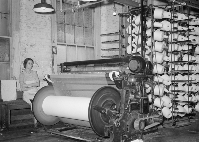 Warp winding machine with operator. Laurel mills, Laurel Mississ ...