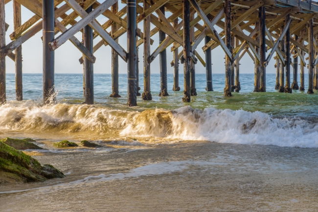 Scenery Photos - waves hitting wooden pier goletta beach california