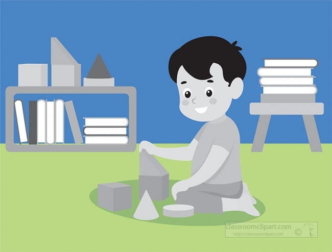 cute boy playing with blocks in kindergarten classroom gray colo ...